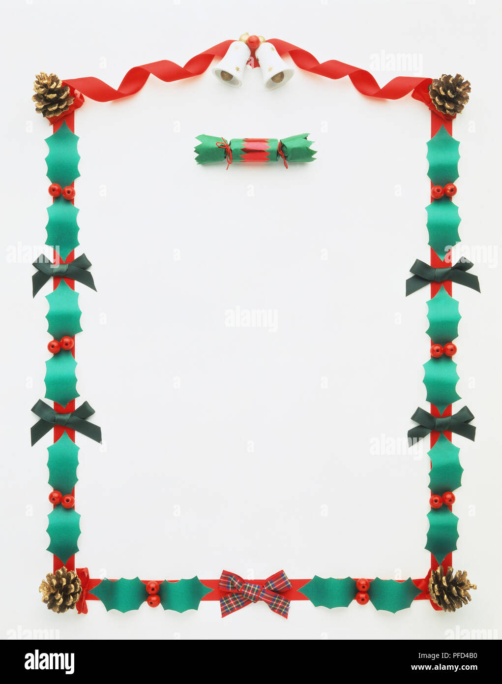Holly border and Christmas cracker Stock Photo - Alamy