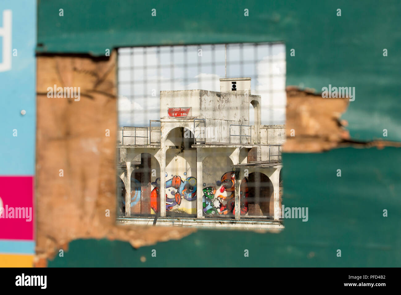 The derelict Lido at Grange Over Sands viewed through fencing on the ...