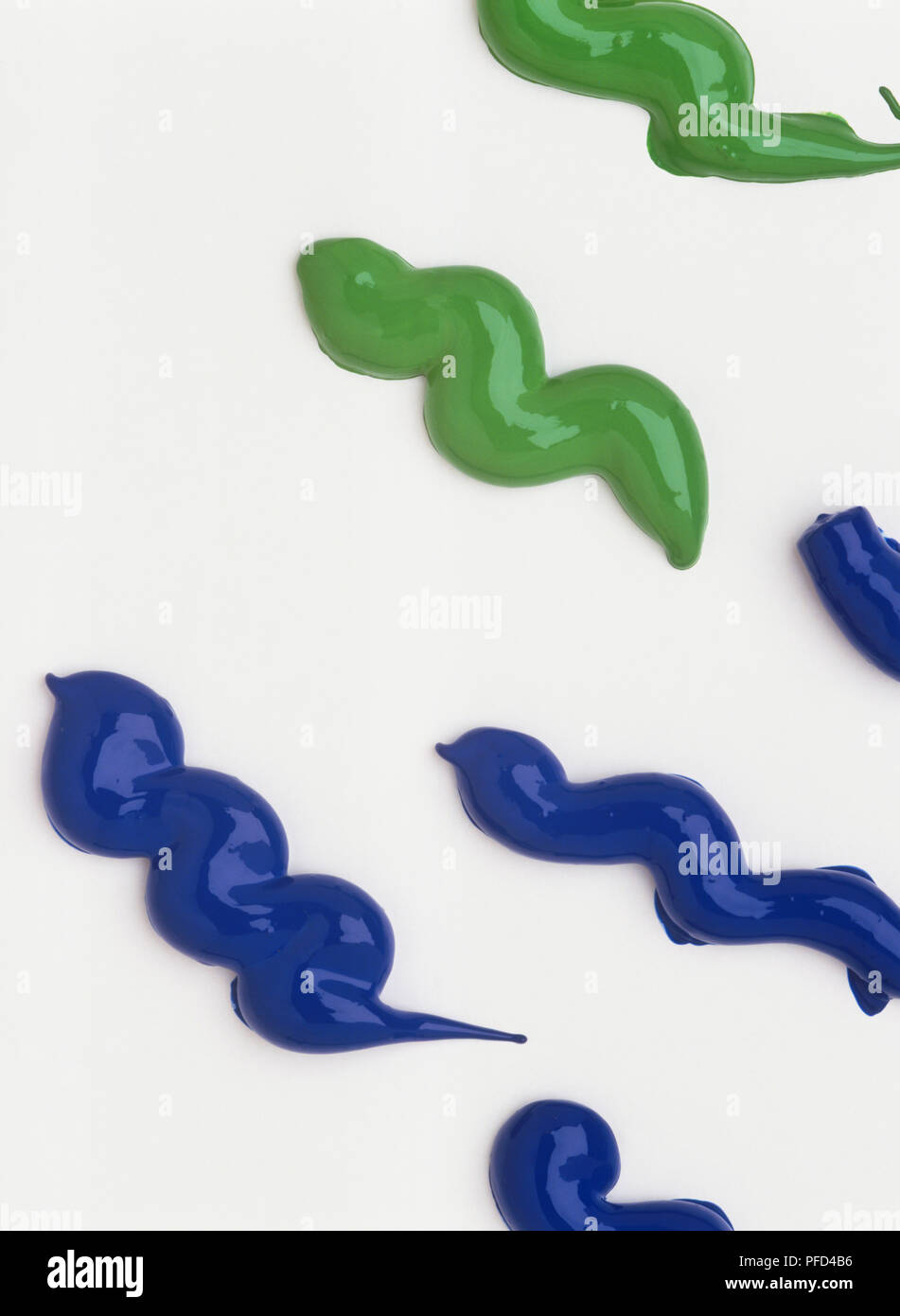 Squiggle of shiny blue paint Stock Photo - Alamy