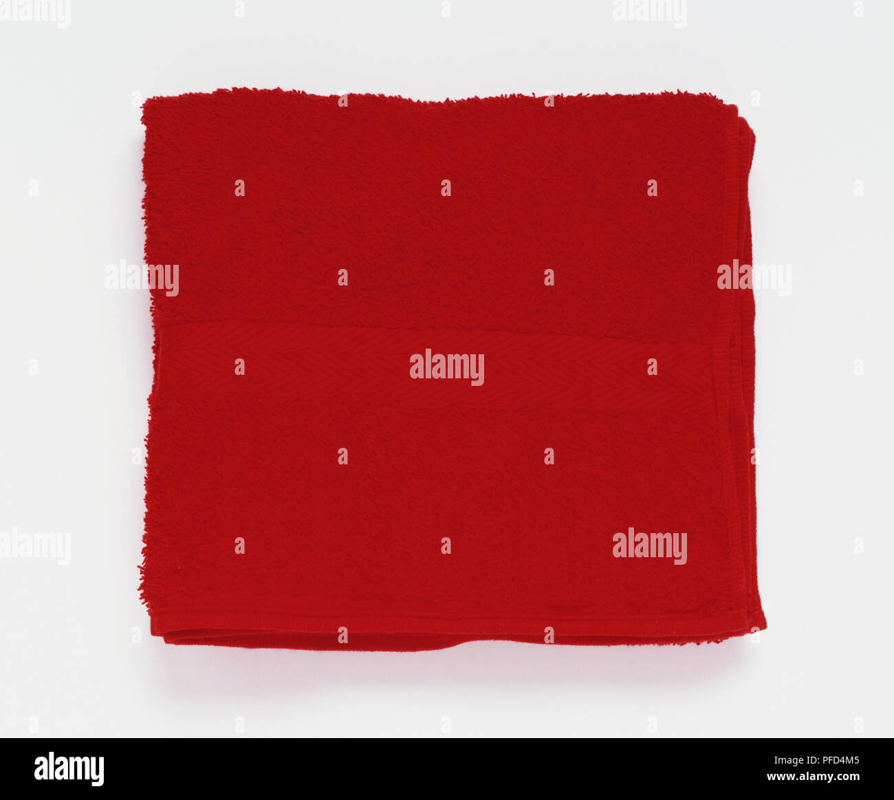Folded red towel Stock Photo - Alamy