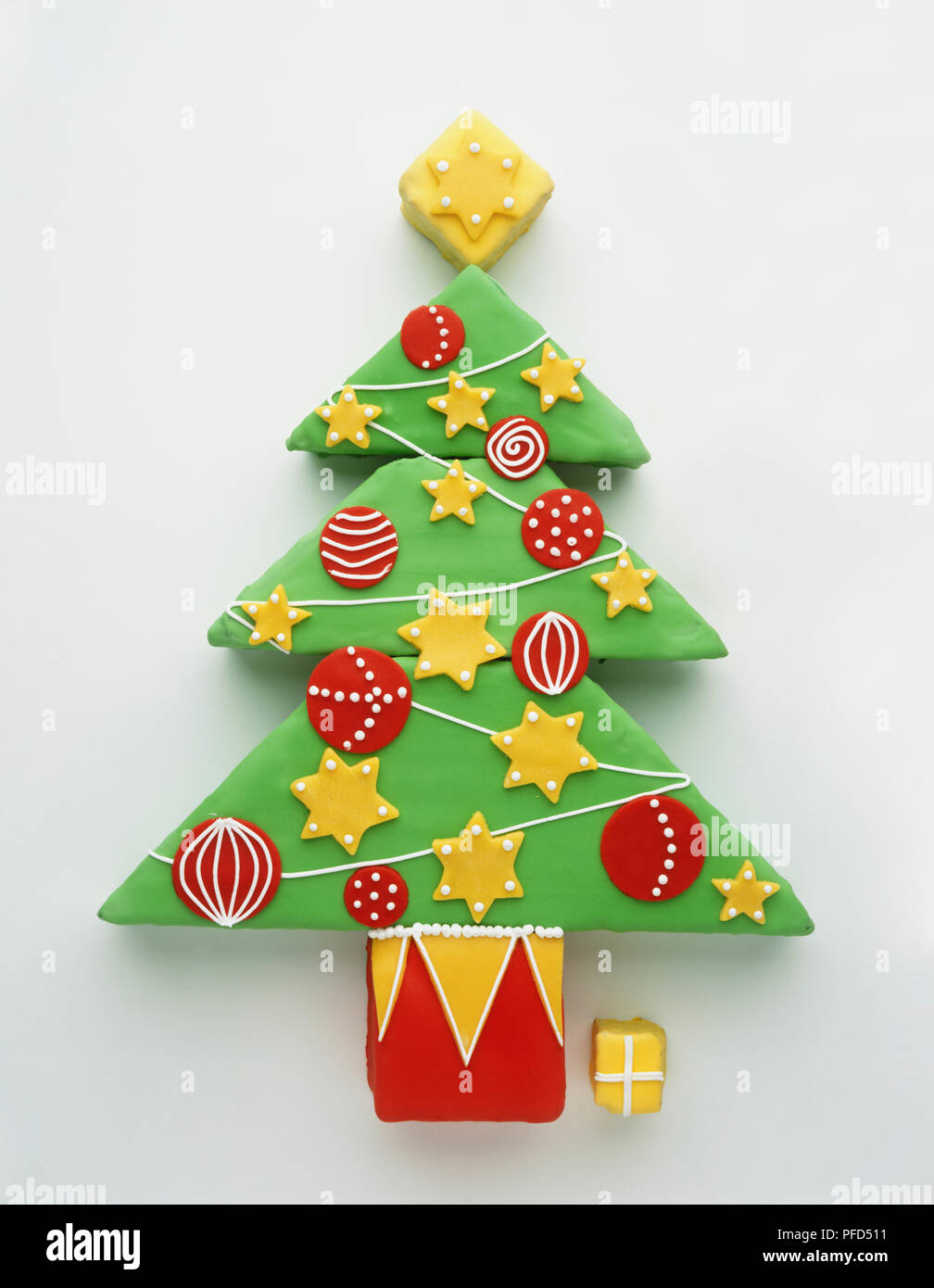 Christmas tree cake coated with colourful icing Stock Photo - Alamy