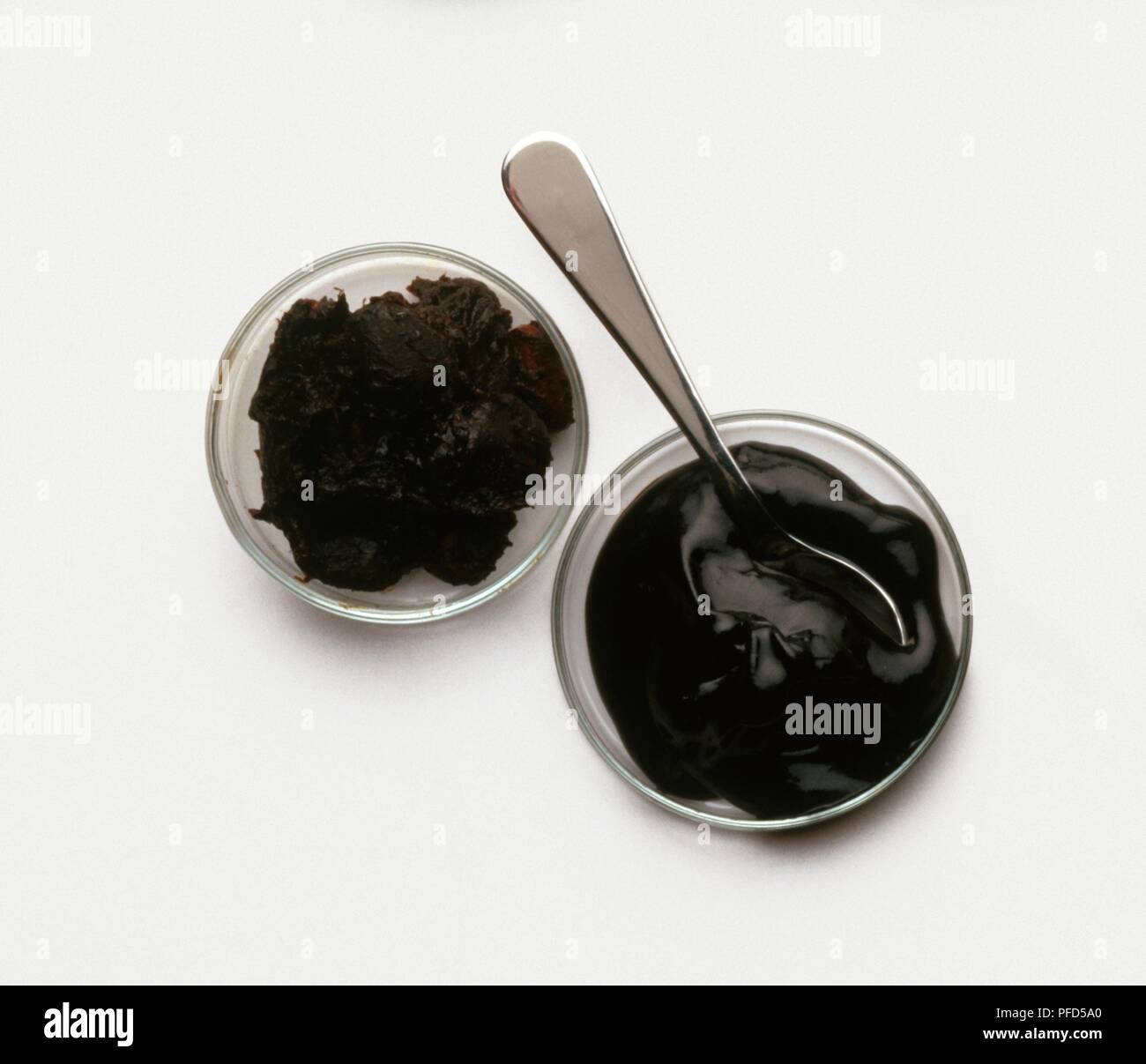 Bowls of black tamarind pulp and jelly Stock Photo - Alamy