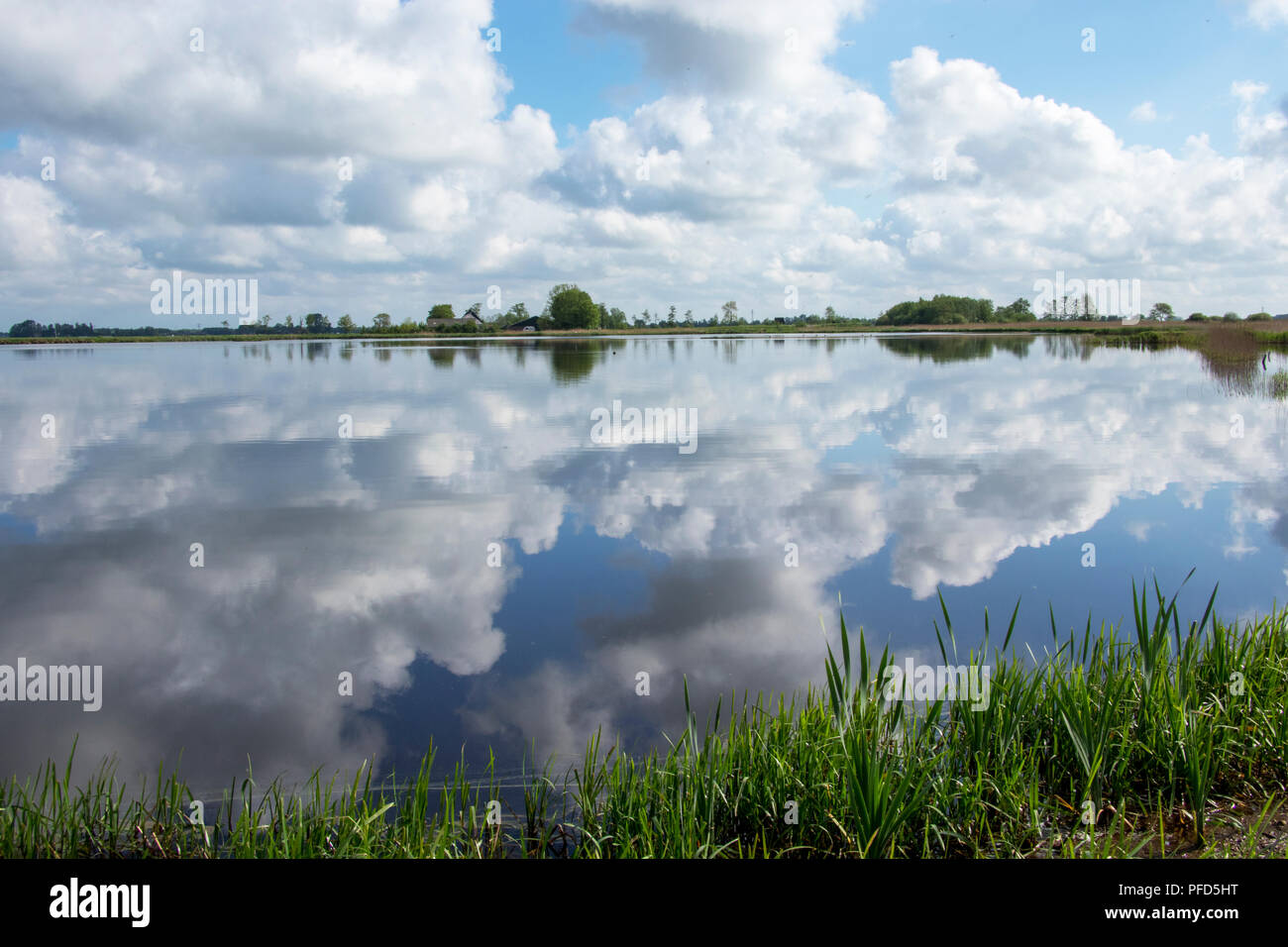 clouds reflected on water Stock Photo - Alamy