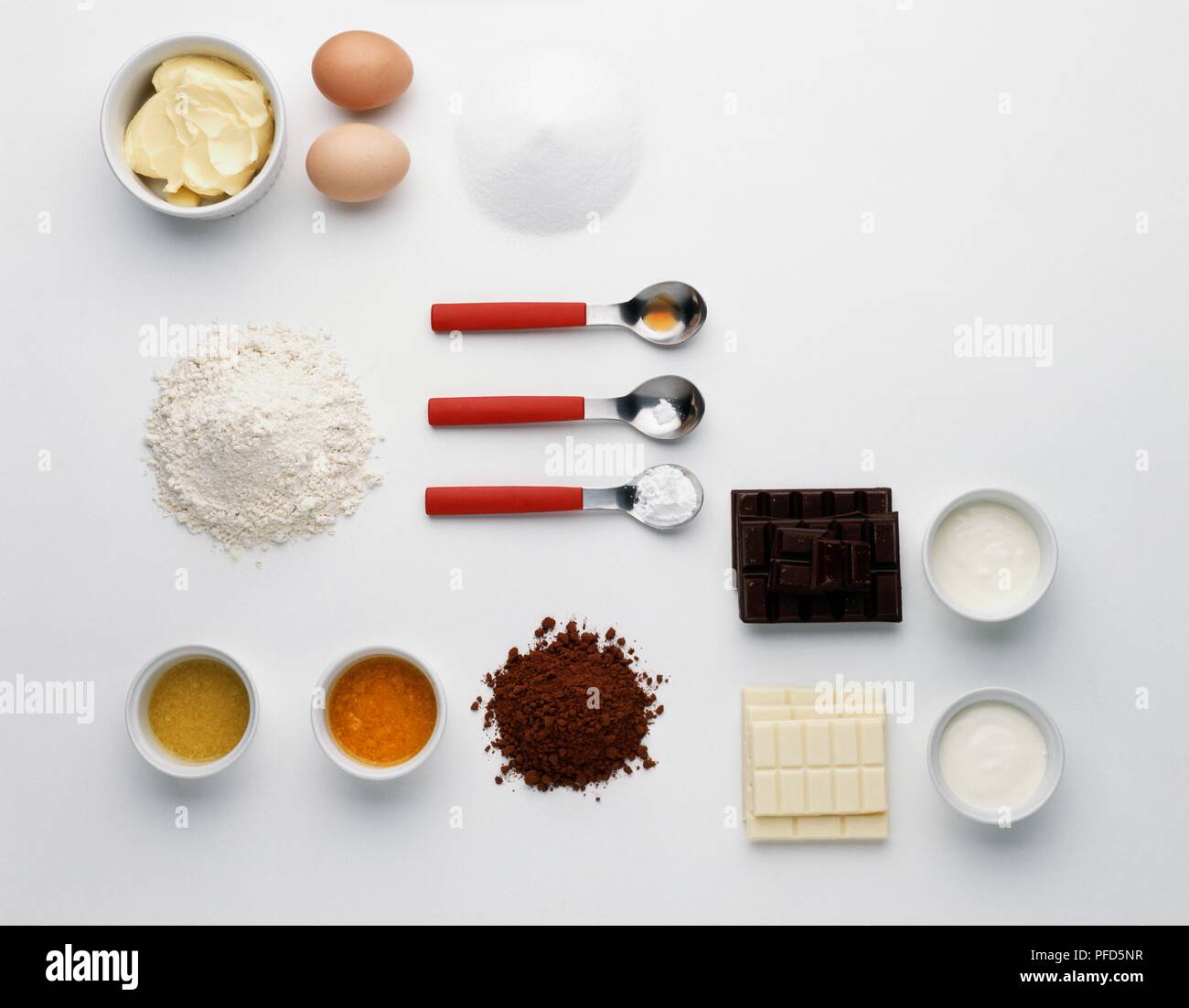 Baking ingredients, including butter, flour, sugar, eggs, chocolate ...