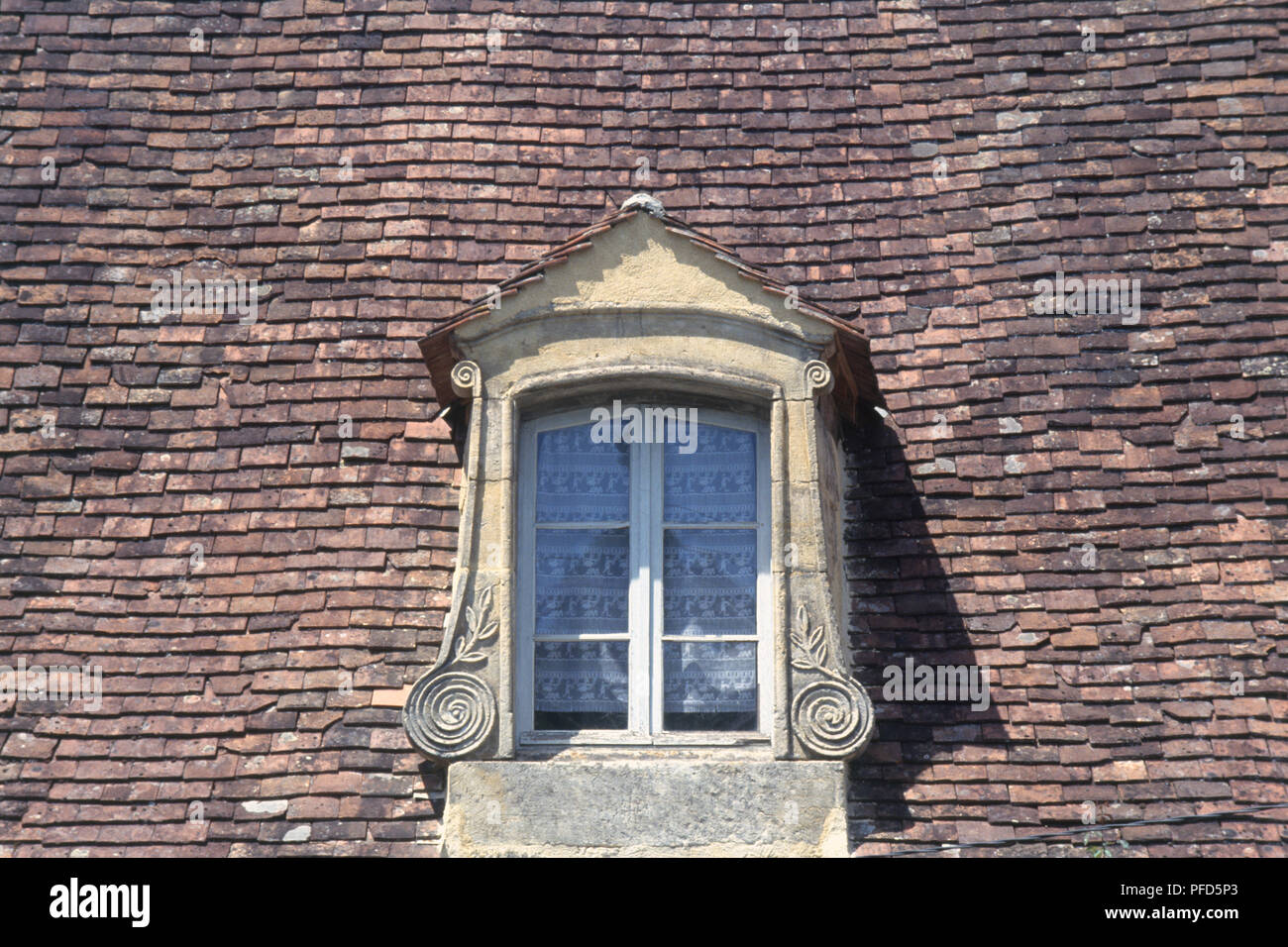 Window in old terracotta tile roof, Northern France Stock Photo - Alamy