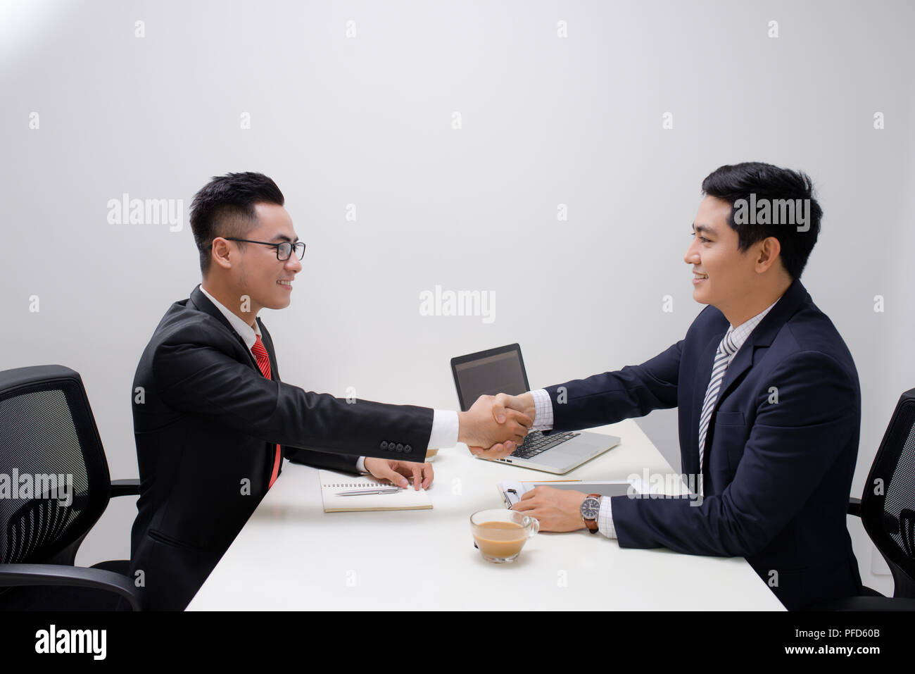 Two men handshake in hi-res stock photography and images - Alamy