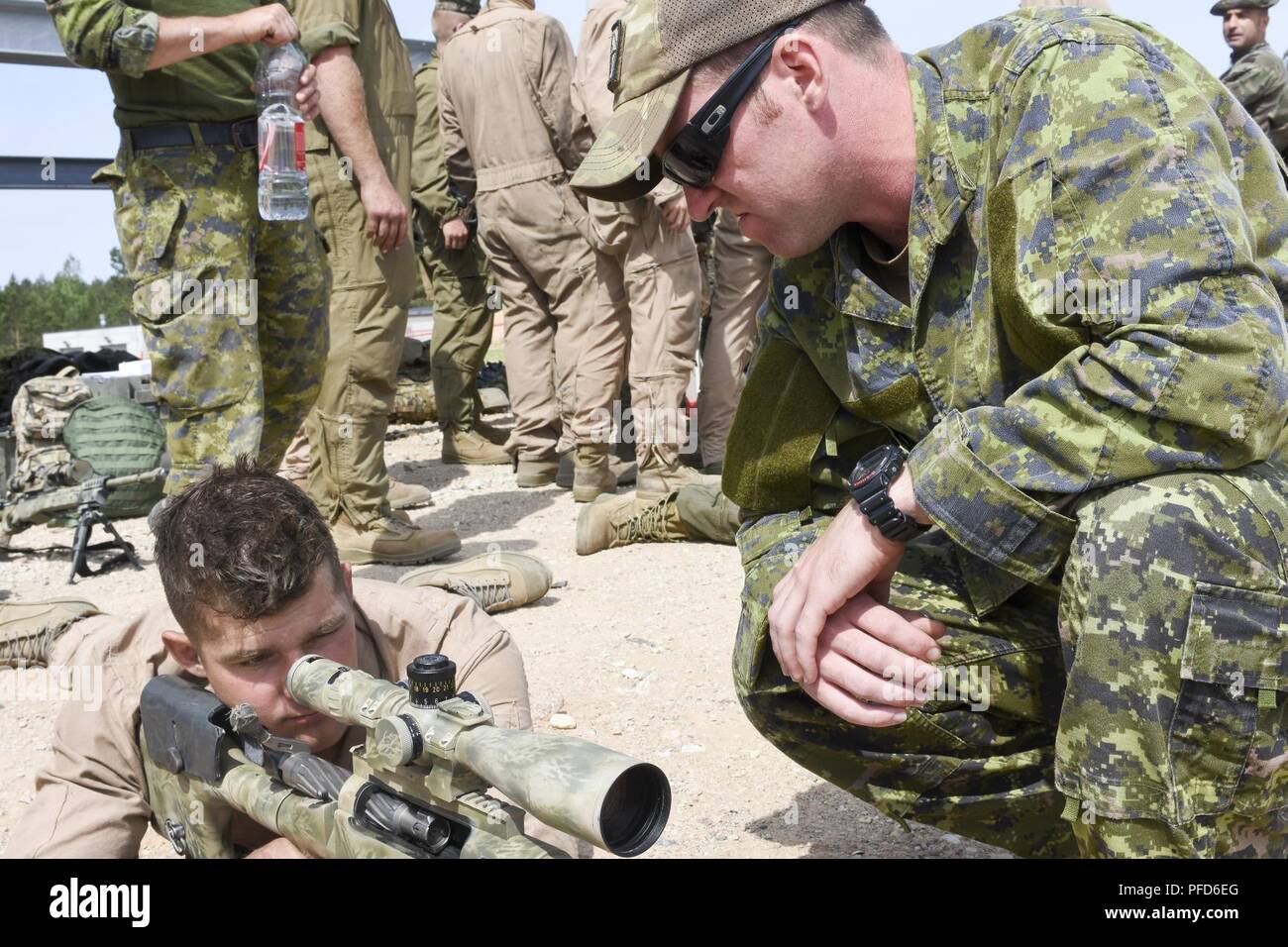 Canadian Army Cpl. Donald Buchan familiarizes U.S. Marine Corps Capt ...
