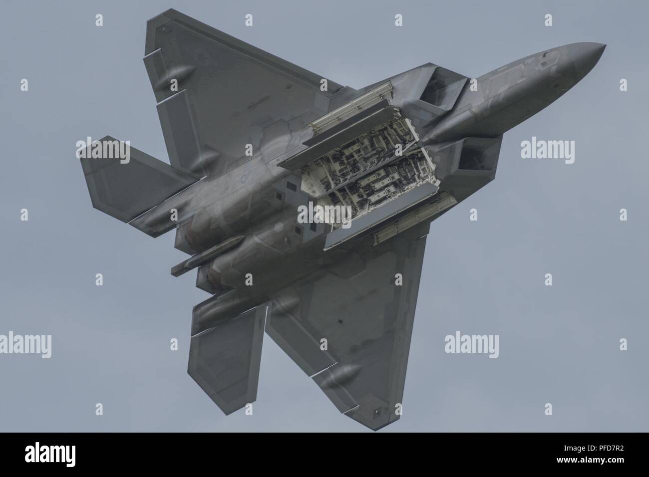 A U.S. F-22 Raptor displays its internal wepons bays during it's ...