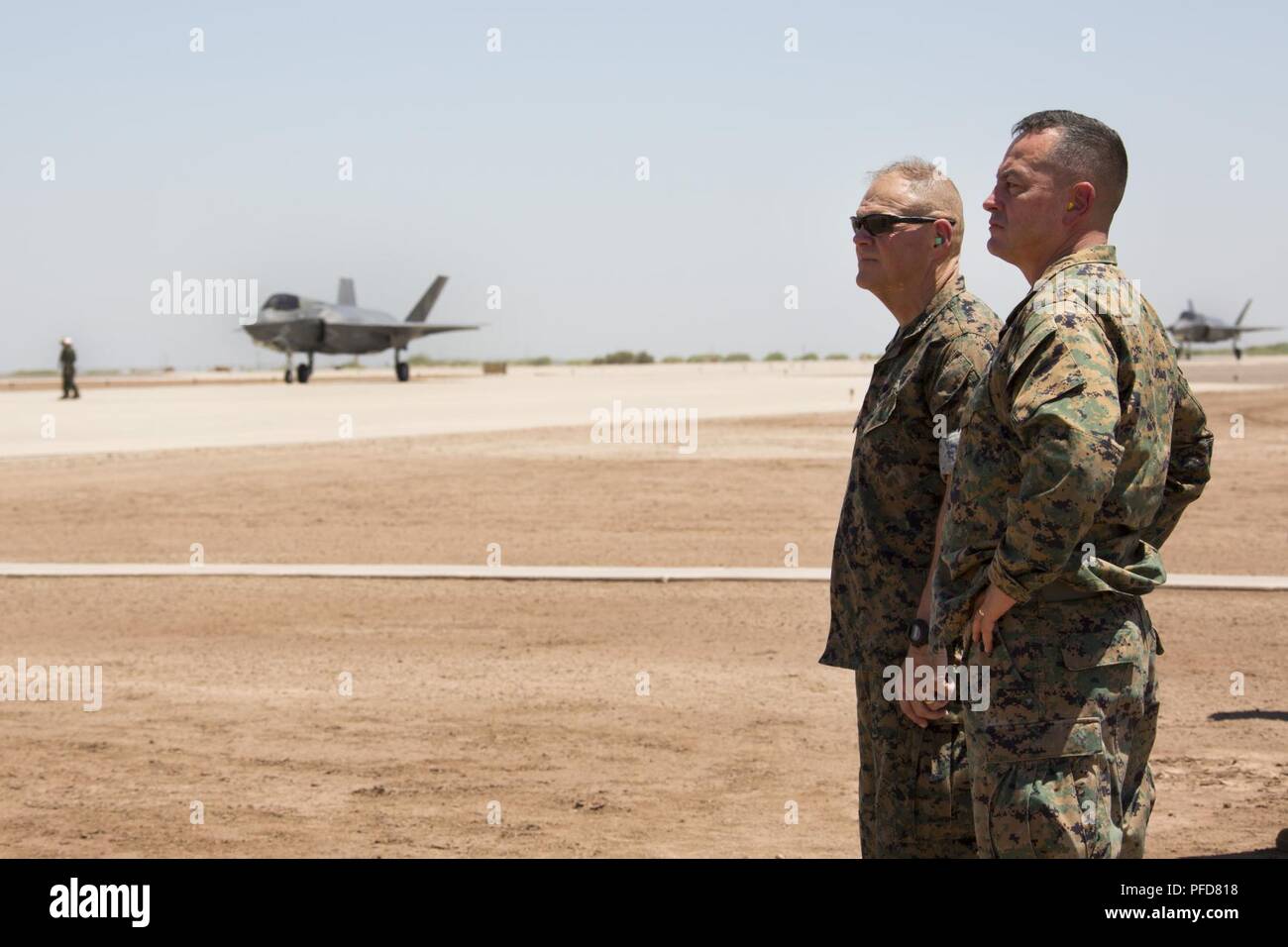 Commandant of the Marine Corps, Gen. Robert B. Neller (left), and ...