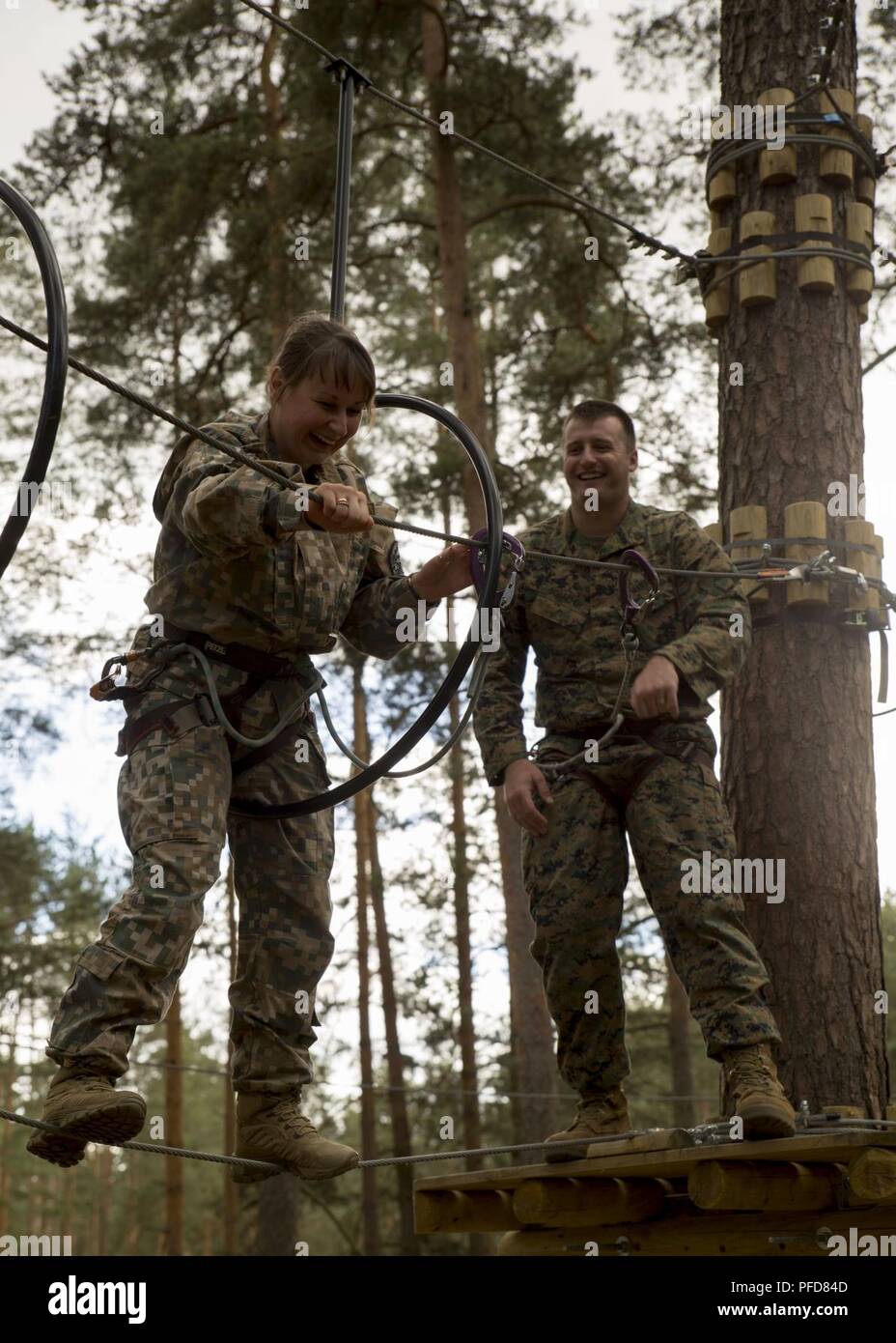 U.S. Marine with 2nd Civil Affairs Group and Latvian soldier with the ...