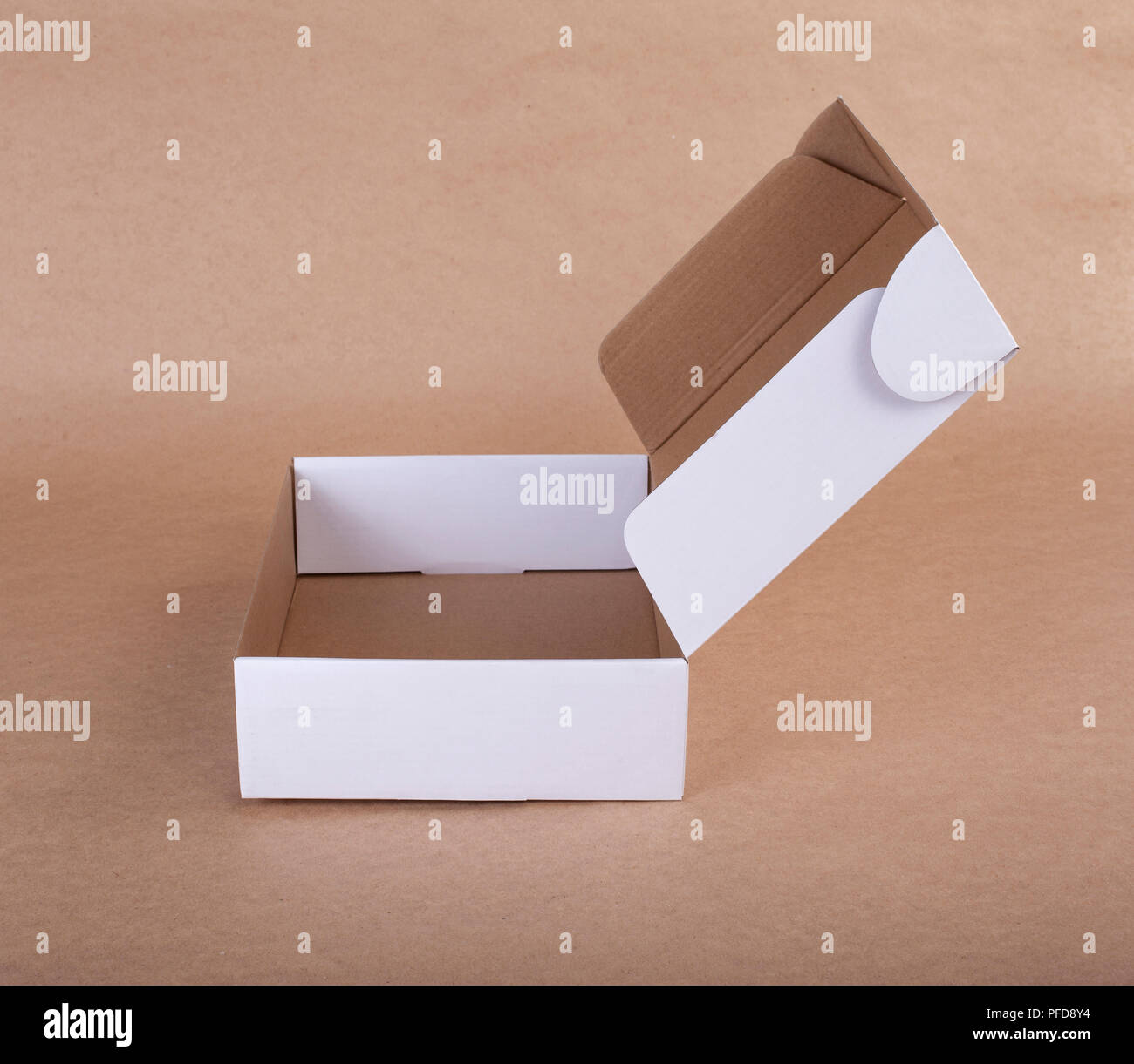 Opened white cardboard box for packaging on a beige background Stock ...