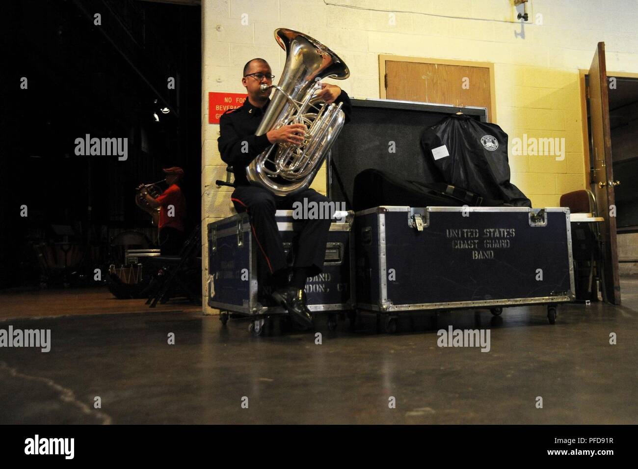 Coast Guard Senior Chief Musician Stephen Lamb warms up backstage on ...