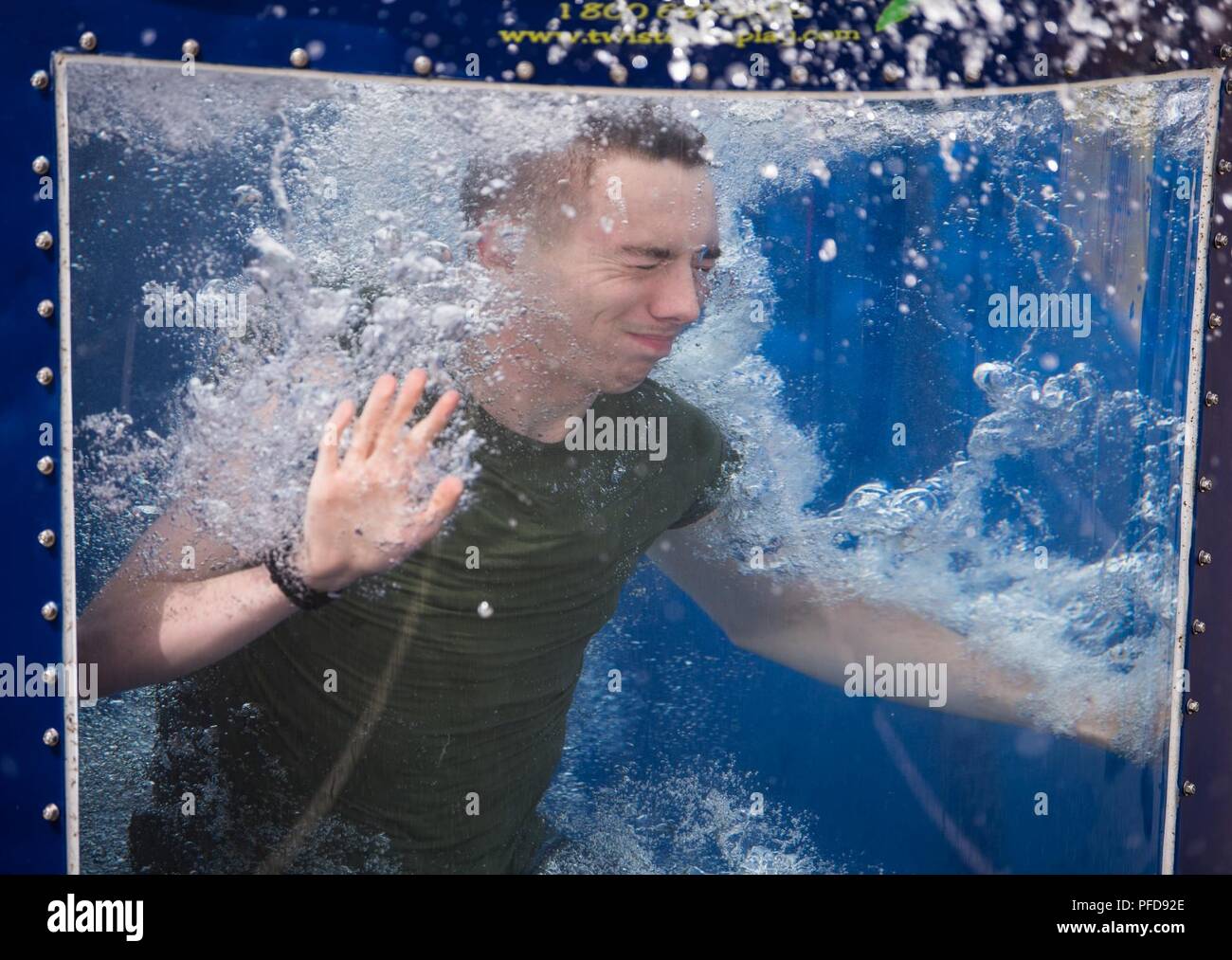 U.S. Air Force Airman Basic Dillon Henry gets dunked while ...