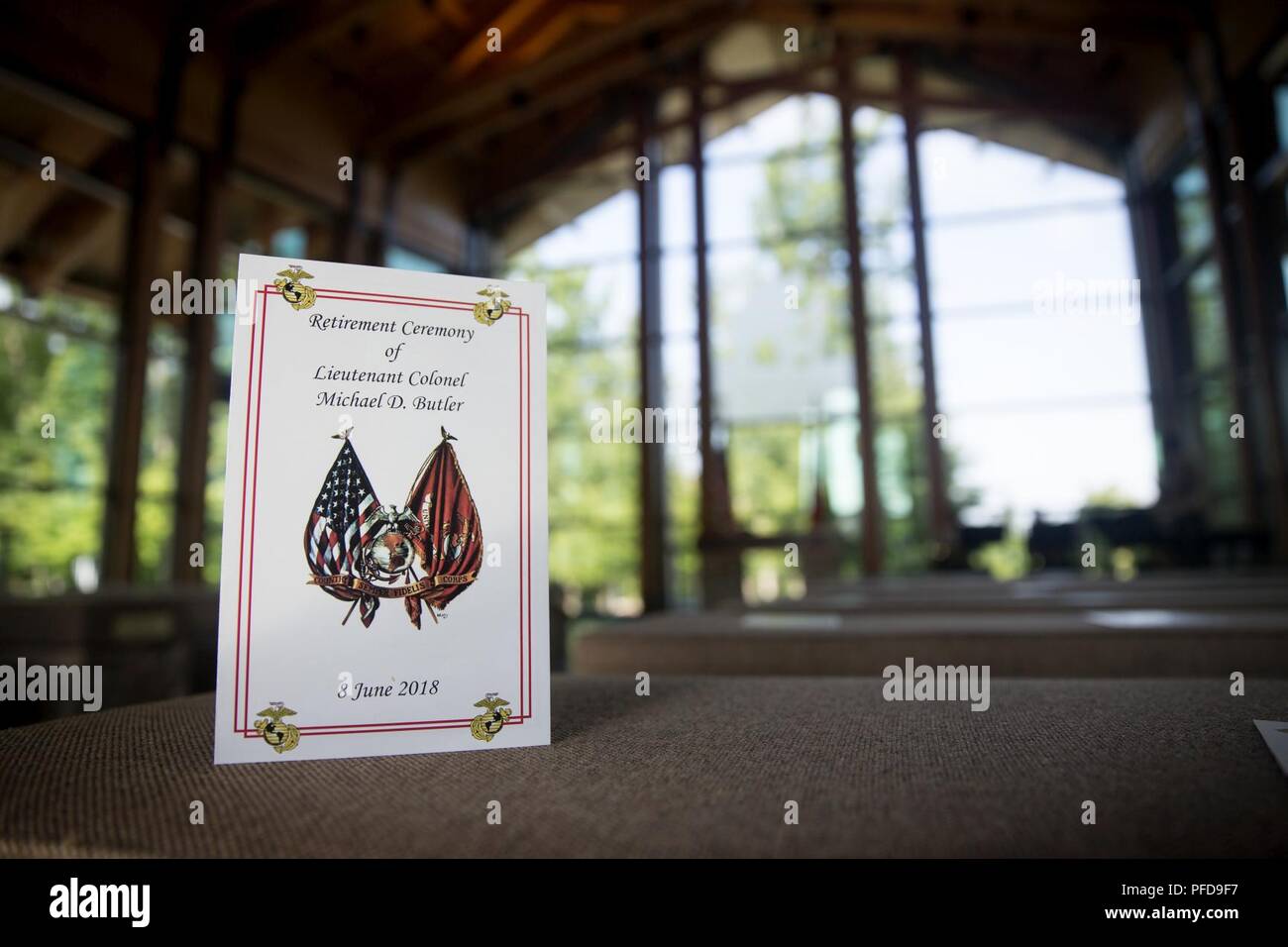 A retirement pamphlet is displayed on a pew before a retirement ...