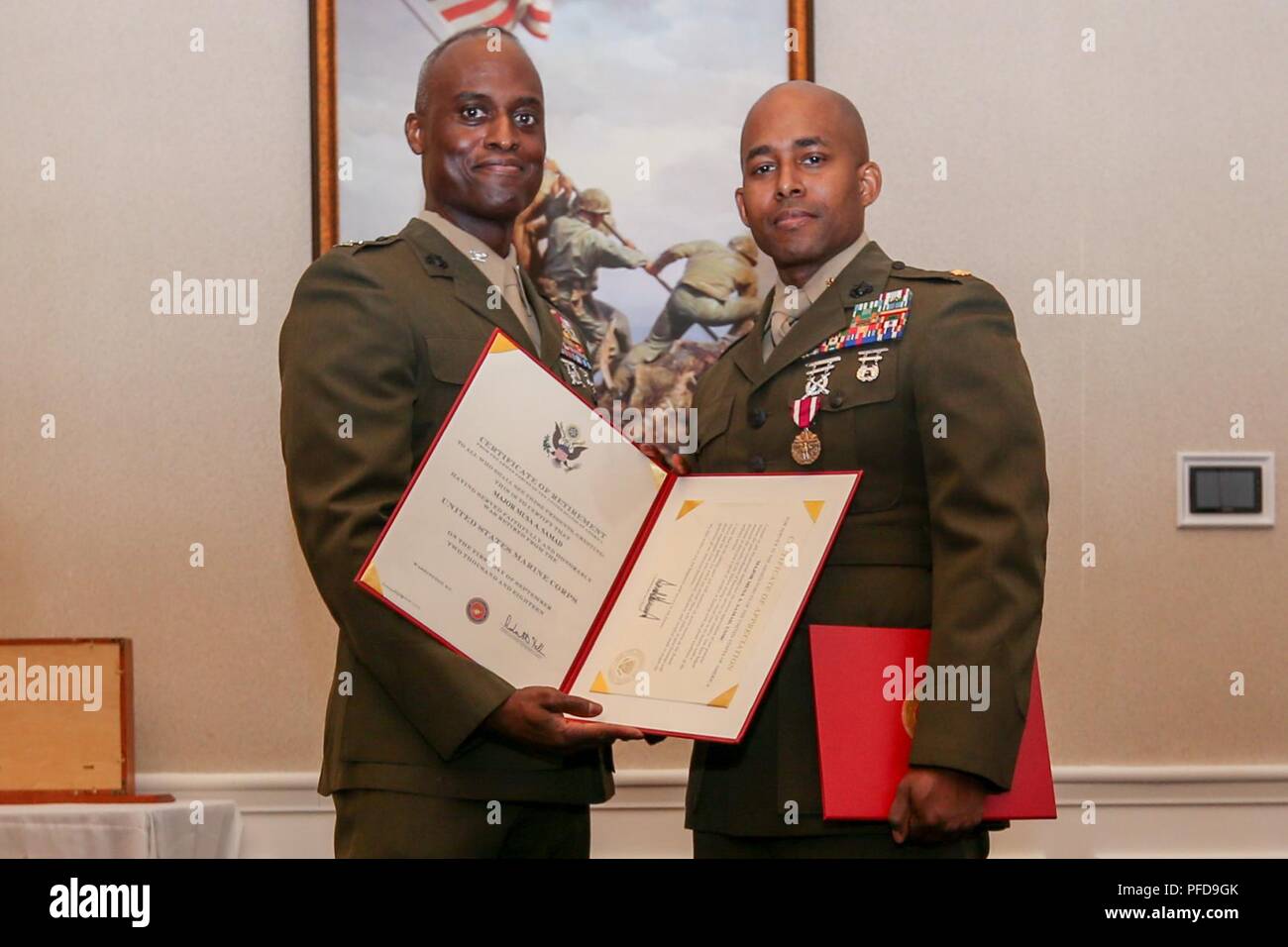 U.S. Marine Corps Col. Gerald Graham, left, commandant of the Marine ...