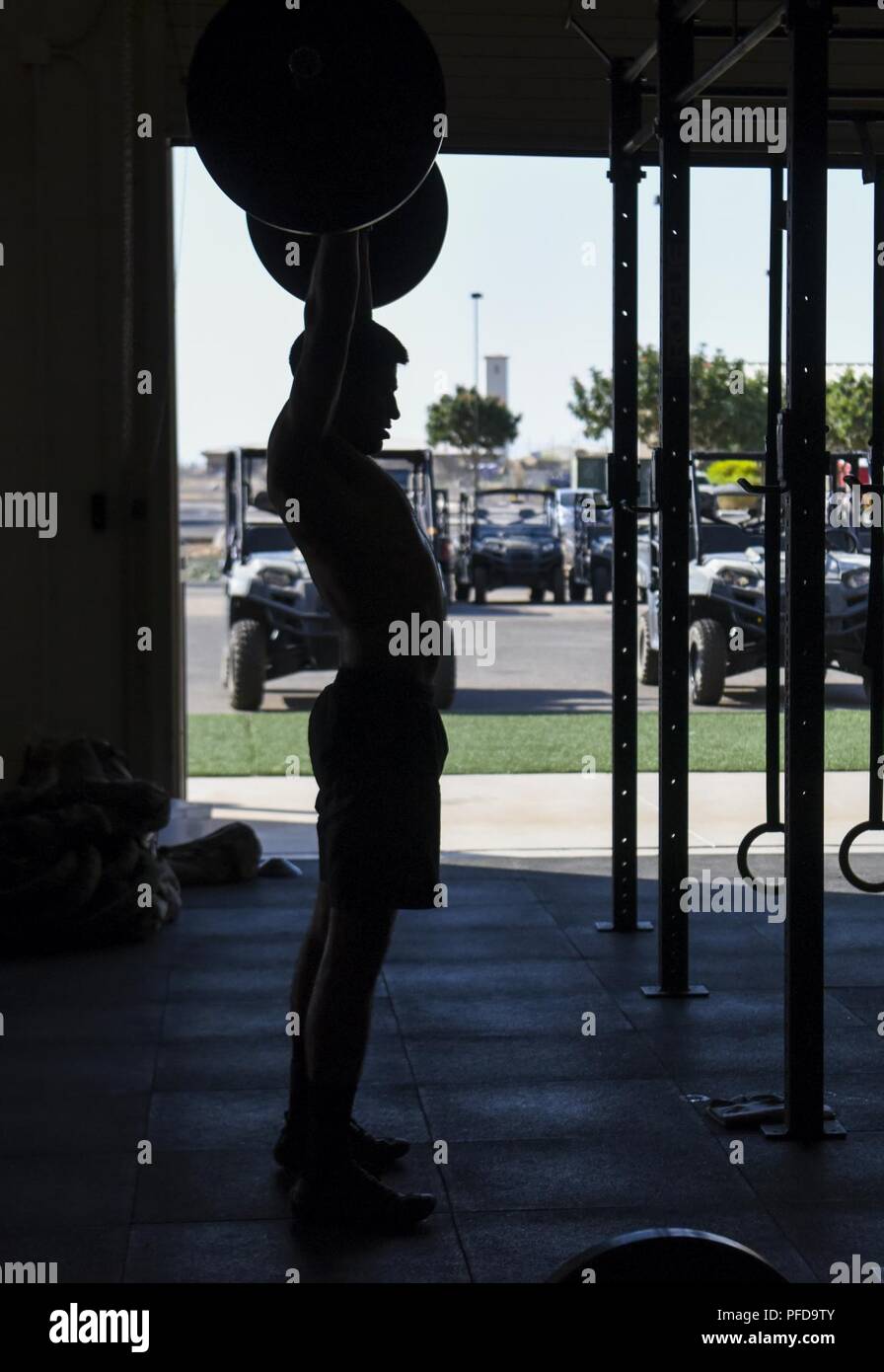 A pararescueman from the 48th Rescue Squadron performs an overhead ...