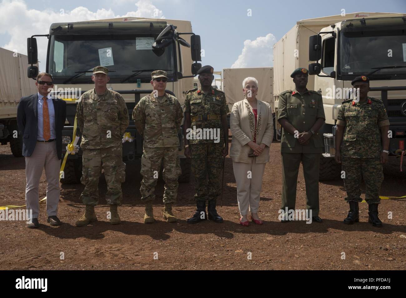 U.S. Ambassador for Uganda, Deborah Malak, receives a tour of vehicles ...