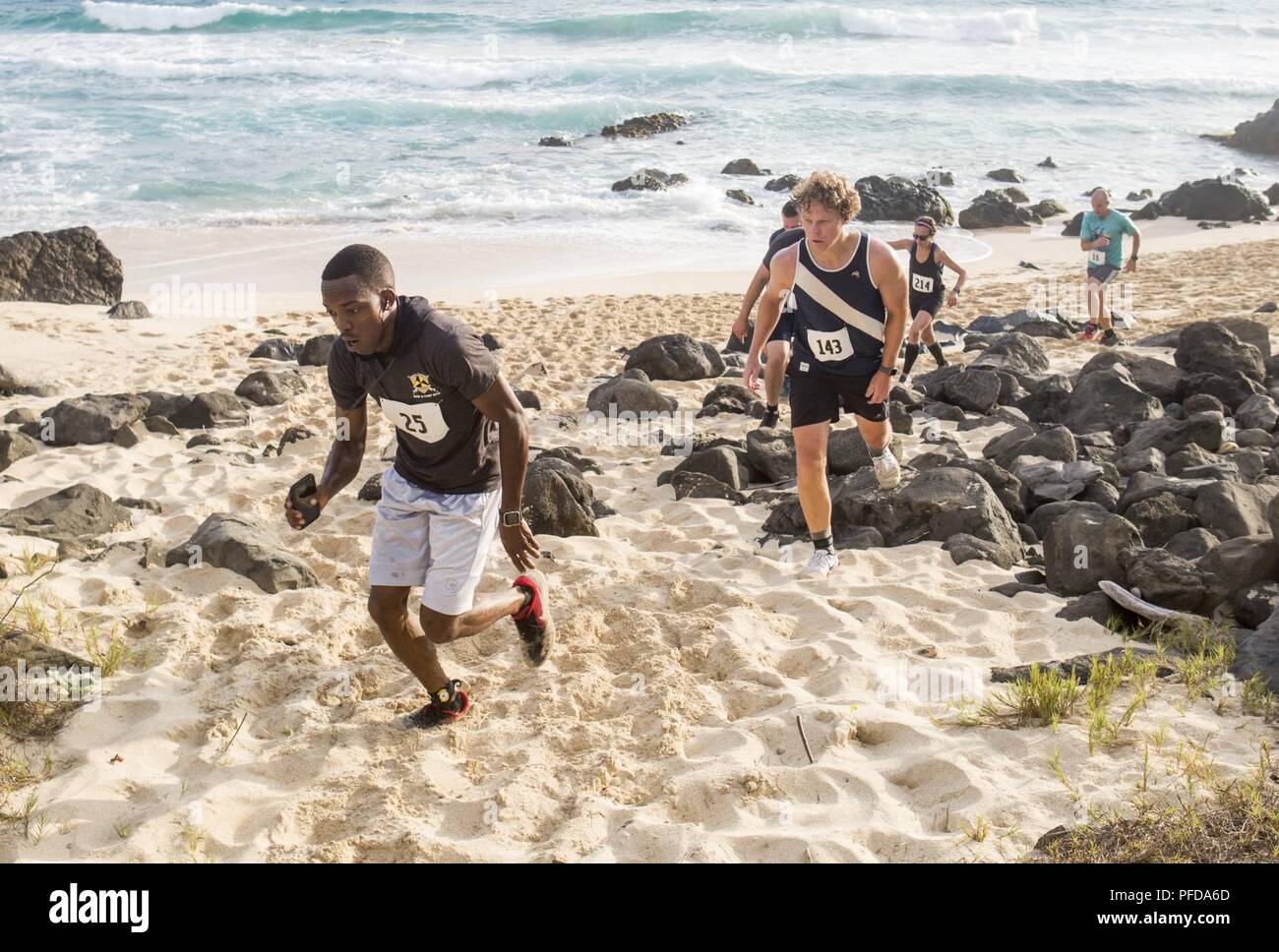 Race participants run the Surf N’ Turf 5k race at North Beach, Marine ...