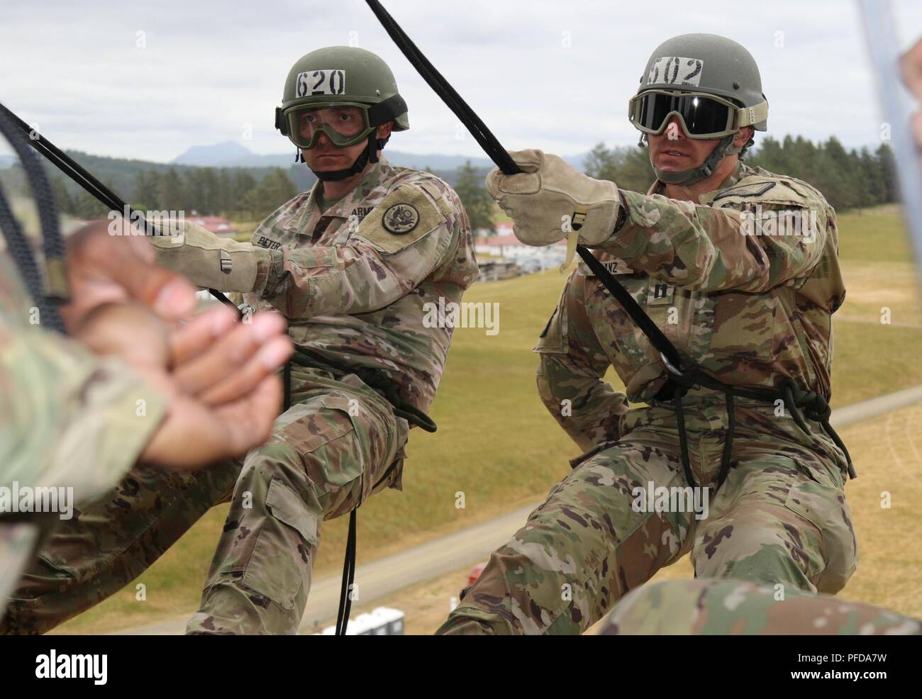 Soldiers are hooked up and ready to rappel from a UH-60 Black Hawk ...