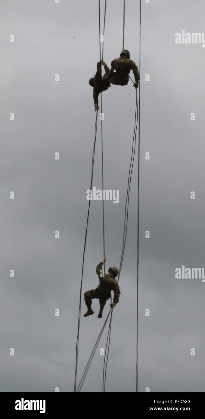 Soldiers and Airmen rappel from a UH-60 helicopter during the final ...