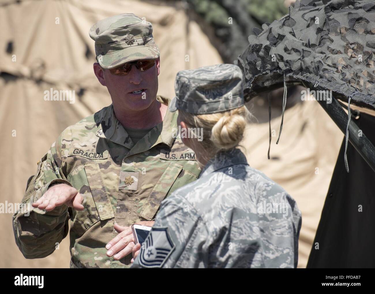 Maj. Jason Gracida, the 2-116 battalion commander, talks with Master ...