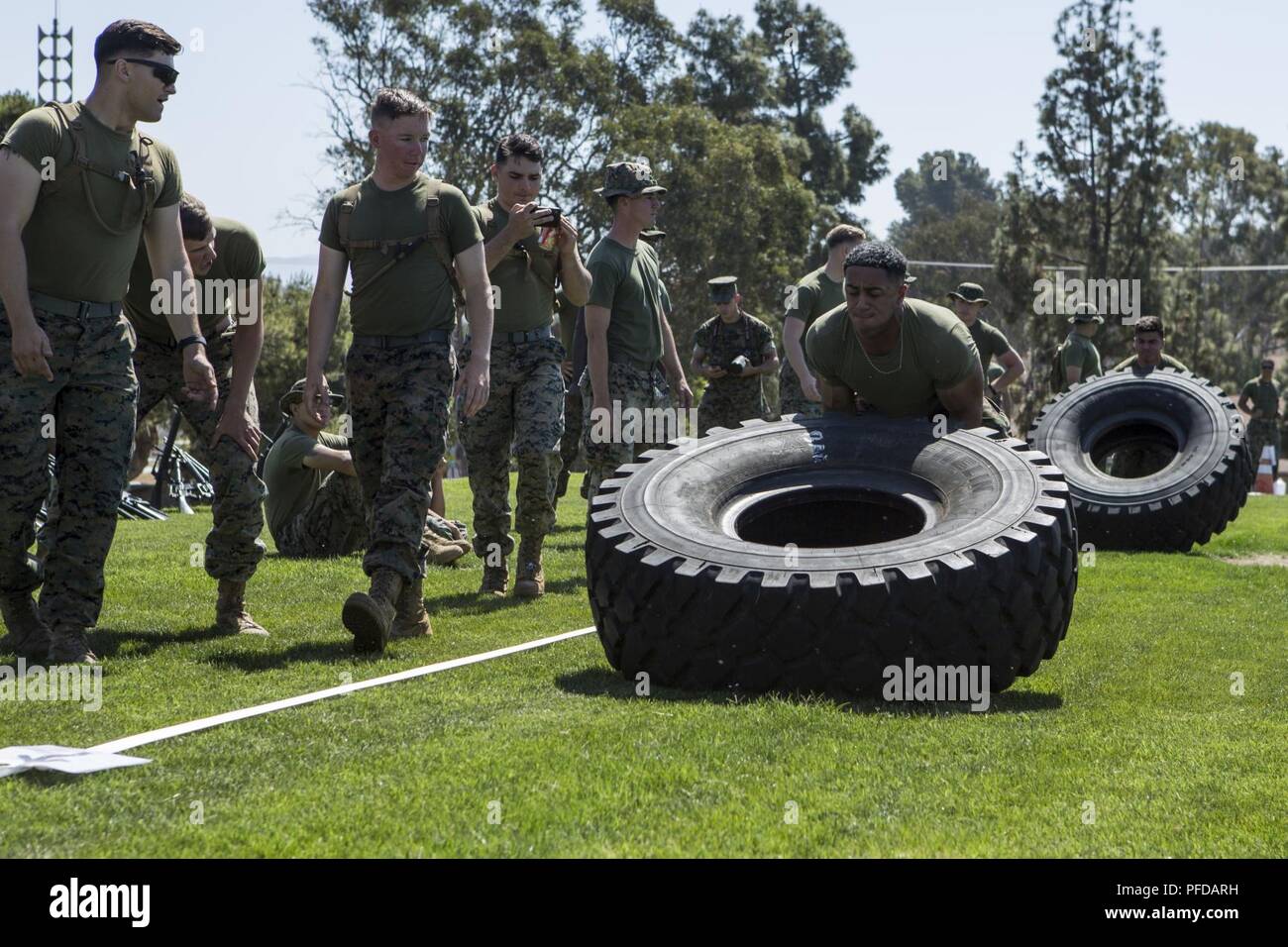 U.S. Marine Corps Cpl. Giovanni Milan, center, a motor transport ...