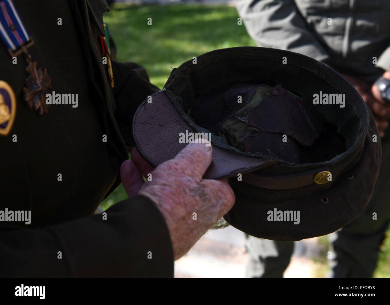 D-Day survivor Dennis Thompson shows his original World War II-era Army ...