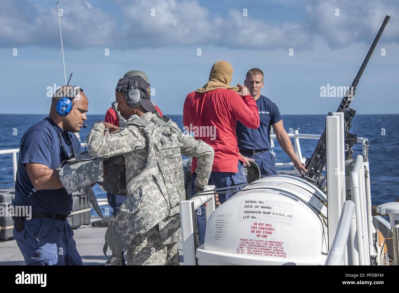 Crewmembers of the Coast Guard Cutter Joseph Tezanos conduct a .50 ...