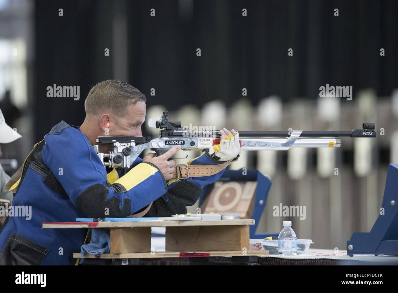 Navy Chief Petty Officer Tim Vaughn competes in air rifle during the ...