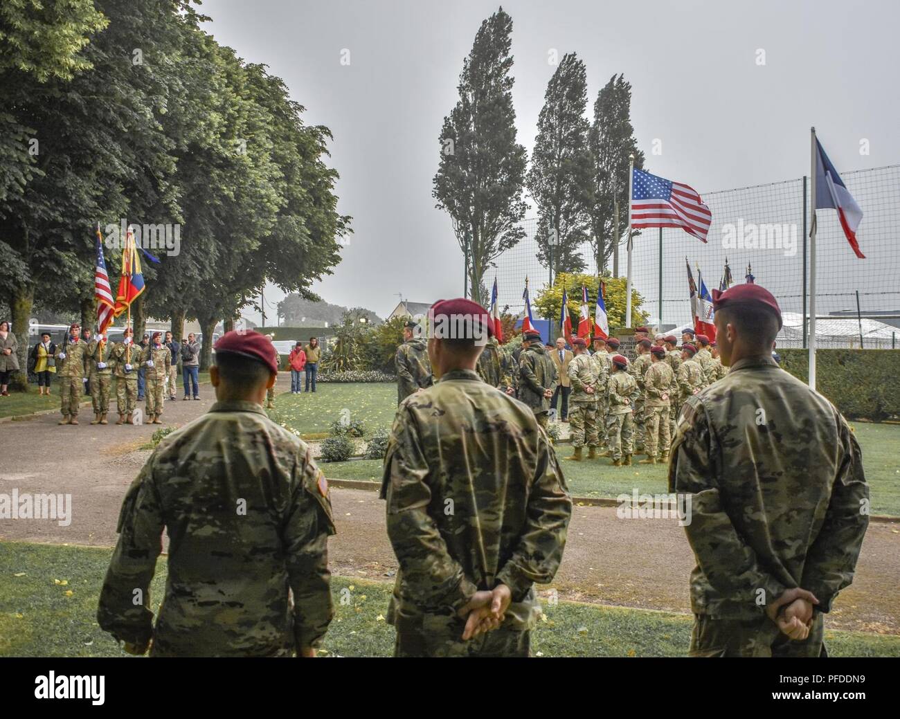 Leaders stand at attention as the color guard of the 173rd Airborne ...