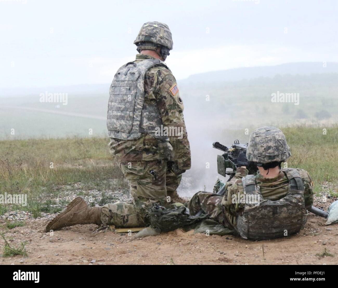 Sgt. Eric N. Fryer assists Pvt. Jordan Scarbrough in conducting M2A1 ...