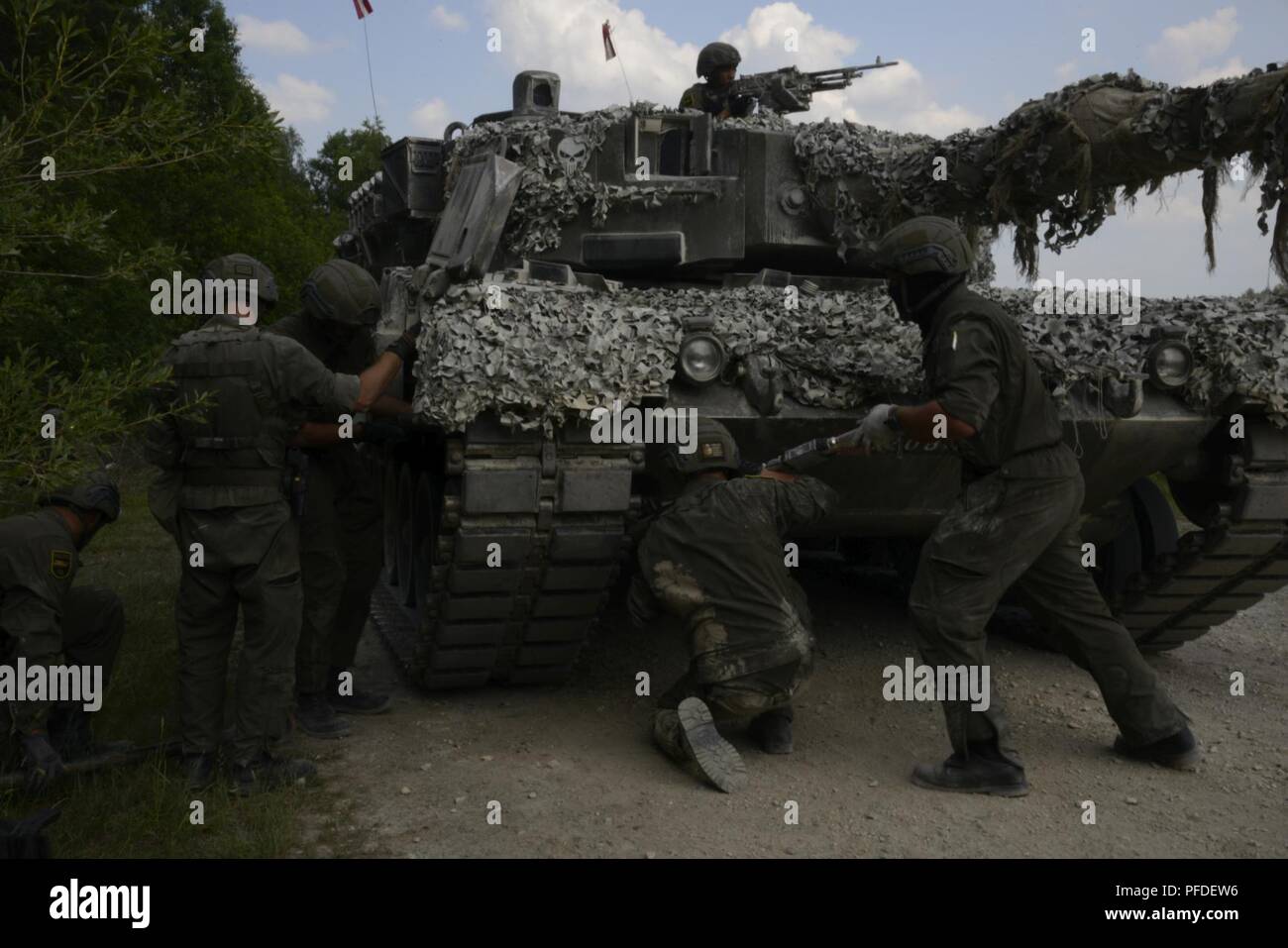 Austrian soldiers assigned to the 6th Tank Company, 14th Panzer ...