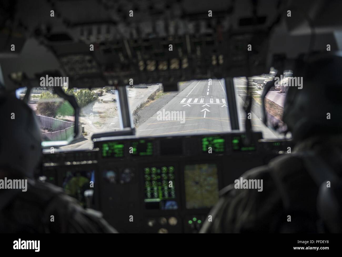 U.S. Air Force Pilots of a C-130J Super Hercules assigned to the 455th ...