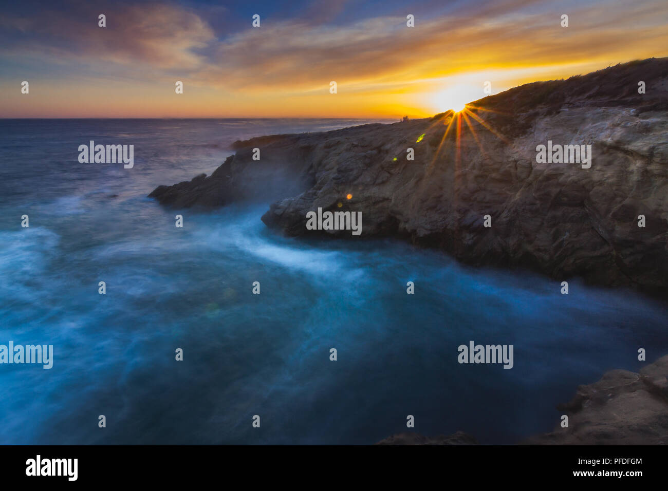 Stunning long-exposure view of smooth waves crashing into rock ...