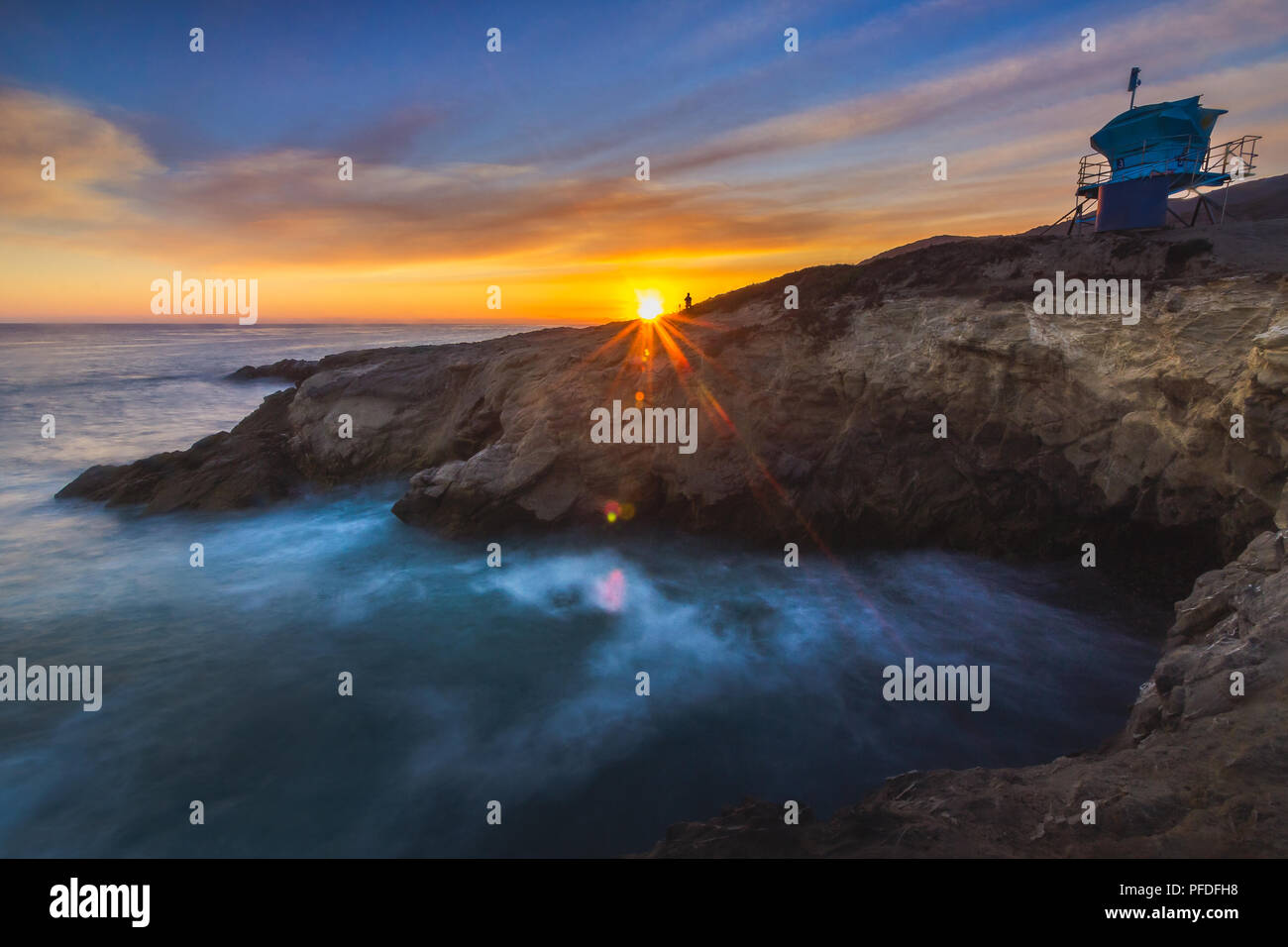 Stunning long-exposure view of smooth waves crashing into rock ...