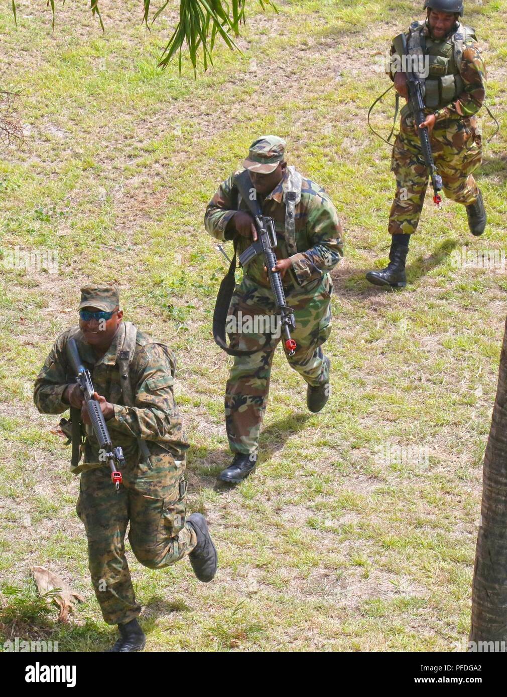 Military of Dominica soldiers run to their objective during the ...