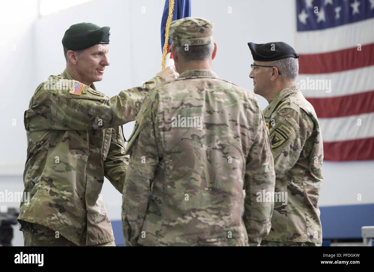 U.S. Army Maj. Gen. Mark C. Schwartz (left) passes the colors of U.S ...