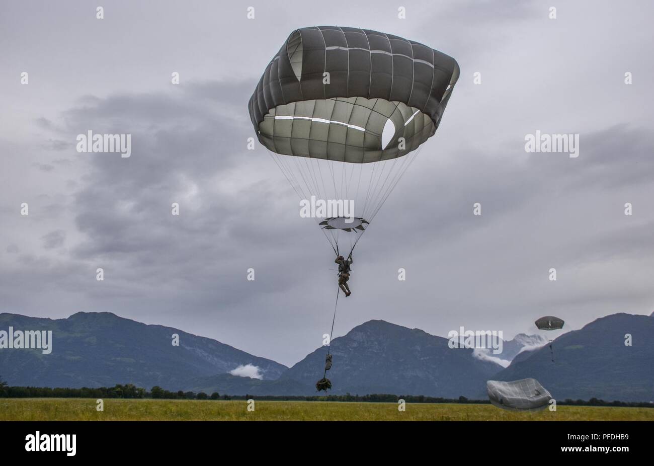 A storm is brewing as a paratrooper from the 173rd Airborne Brigade ...
