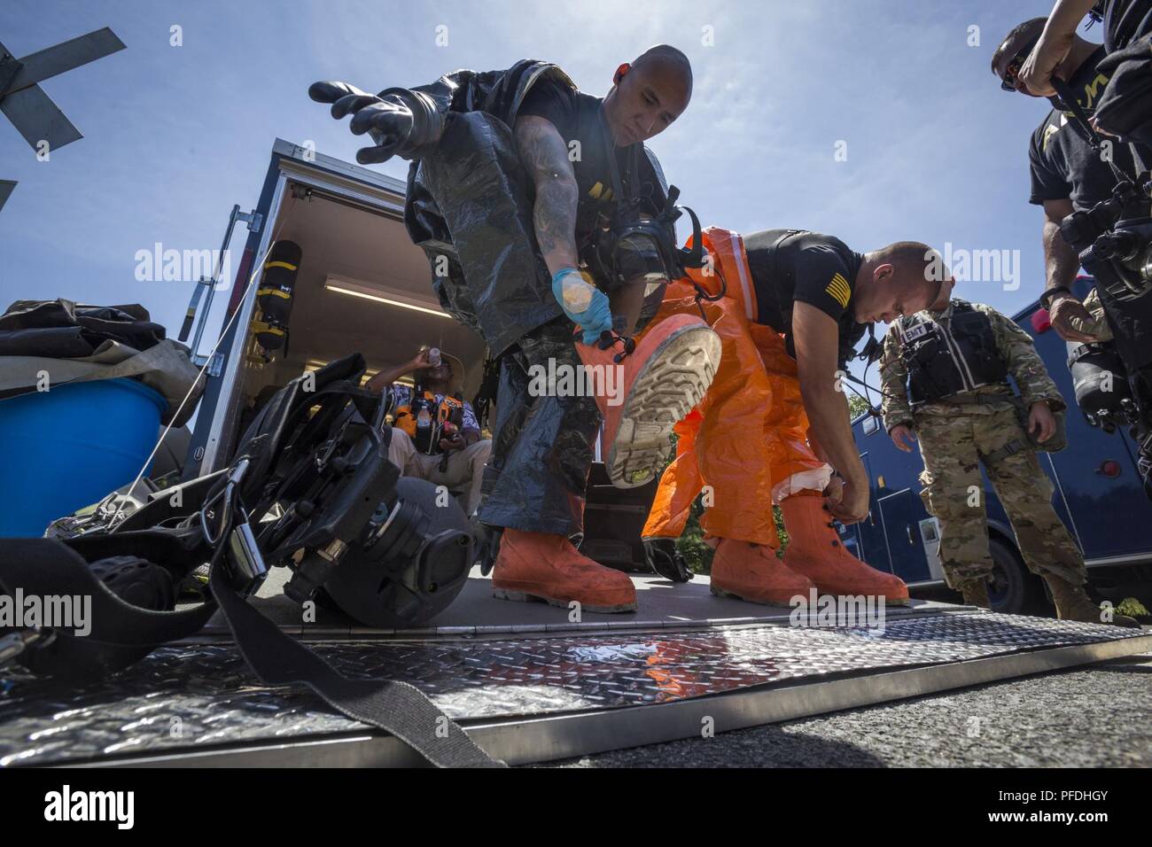 U.S. Army survey team member Staff Sgt. Nicky Lam, left, and survey ...