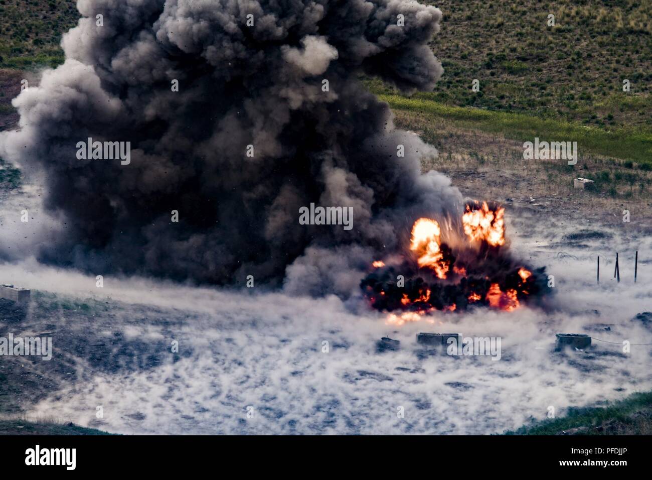 A shape charge detonated by Alpha Company, 898th Brigade Engineer ...