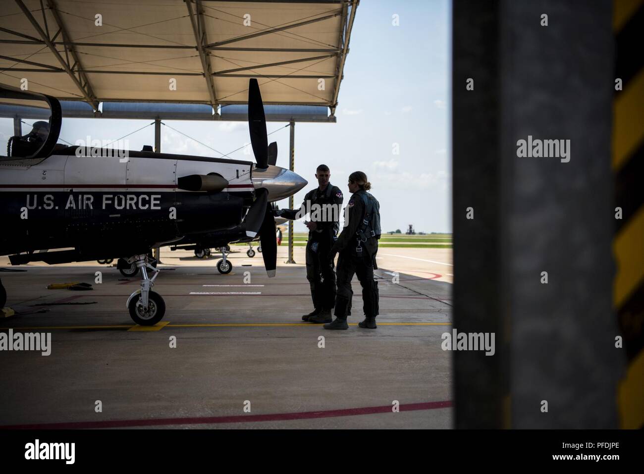 2nd Lt. Benjamin Protzman and Capt. Olga Grover perform a pre-flight ...