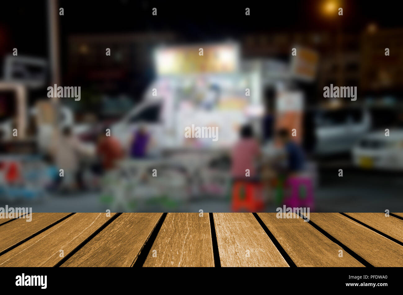 wood table top and Abstract Blurred night market. Can be used for ...