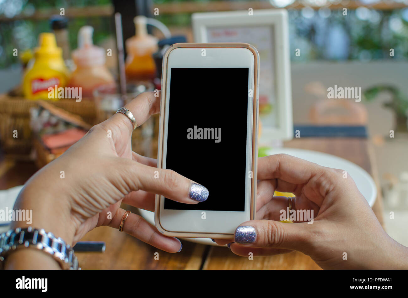 Woman hand shows mobile smartphone with white screen Stock Photo - Alamy