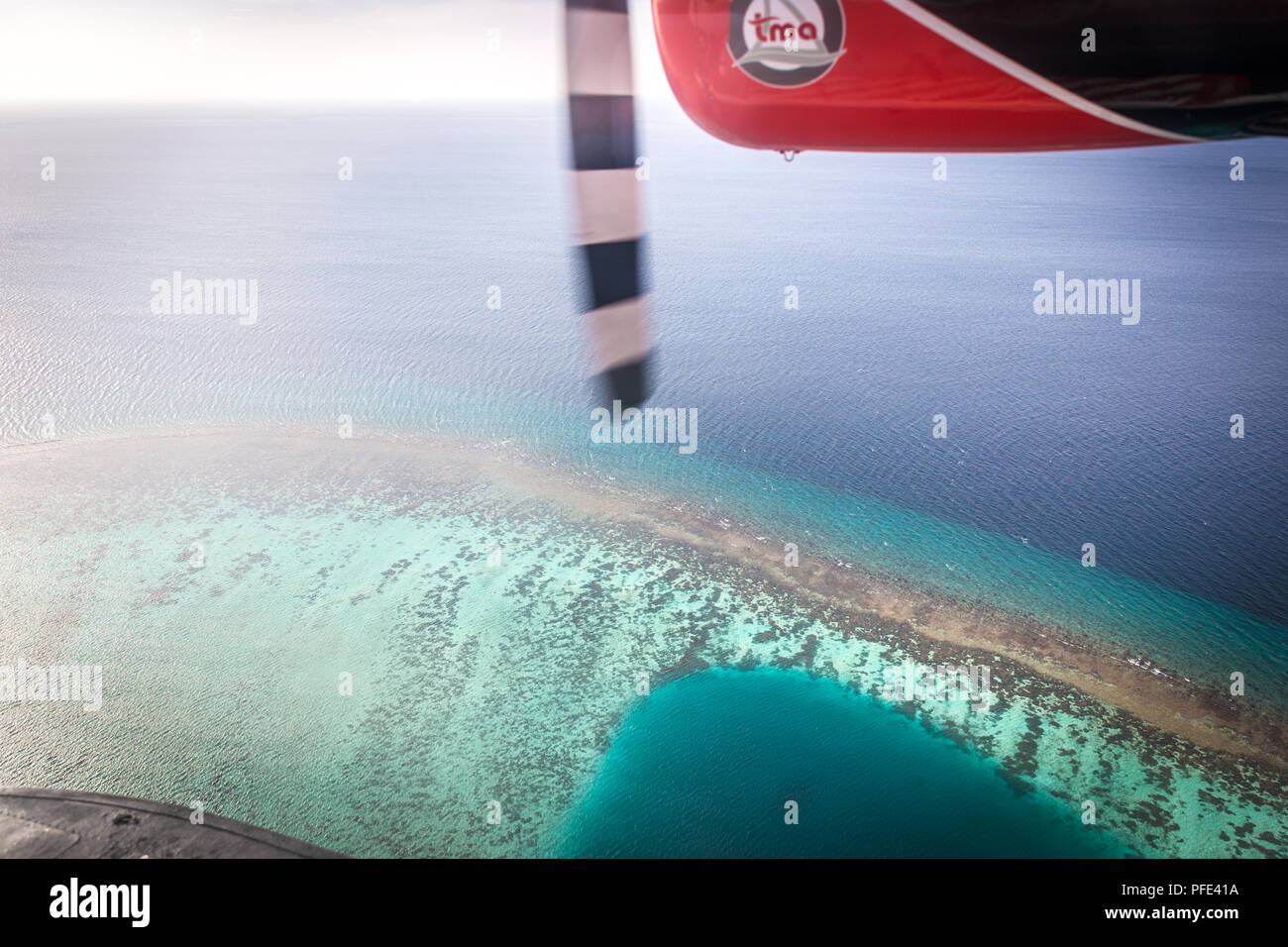 The aerial view from a seaplane in the ocean lagoon of Maldives ...