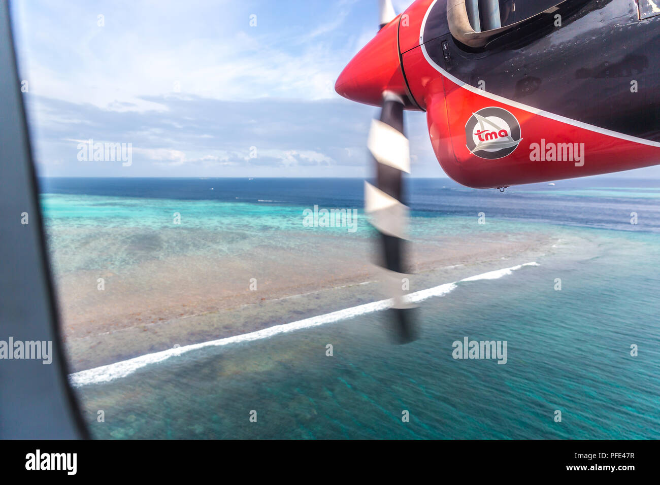 The aerial view from a seaplane in the ocean lagoon of Maldives ...