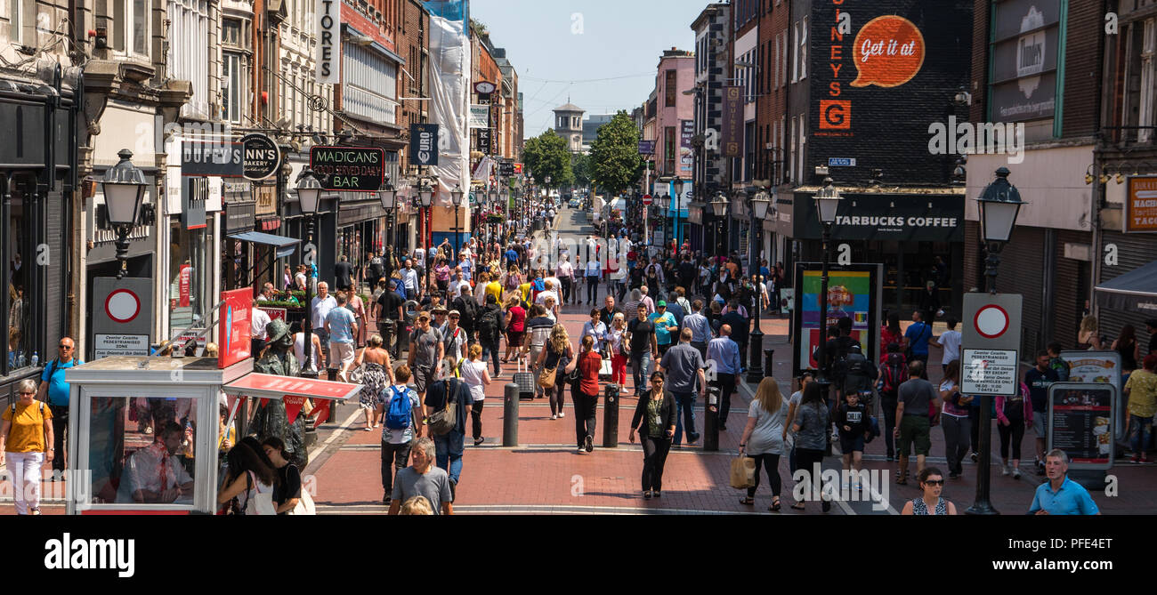 a weather vain with a sailing ship sits atpo roof tops in Ireland Stock ...