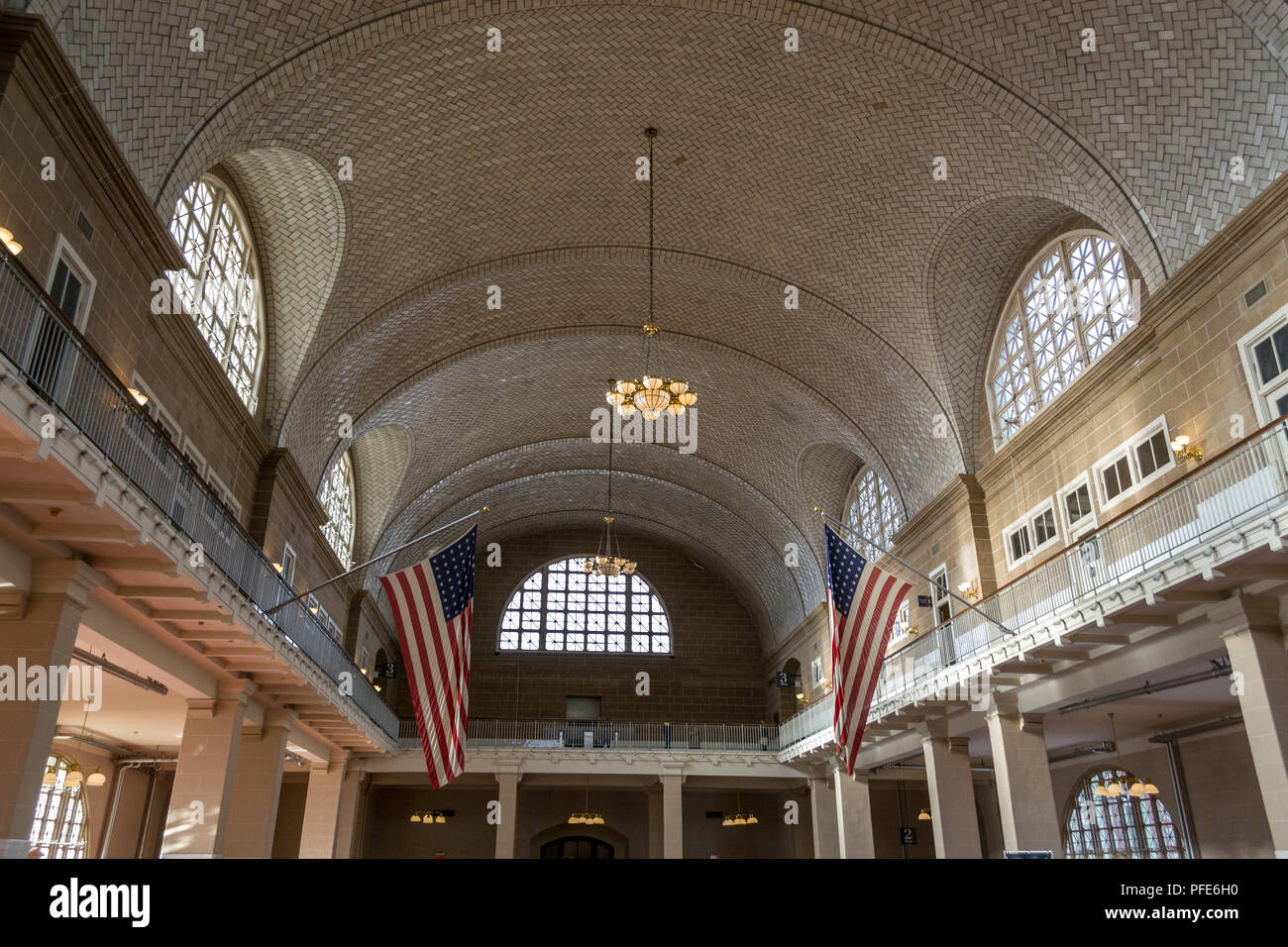 Registry room at Ellis island immigration center between 1900 and 1024 ...