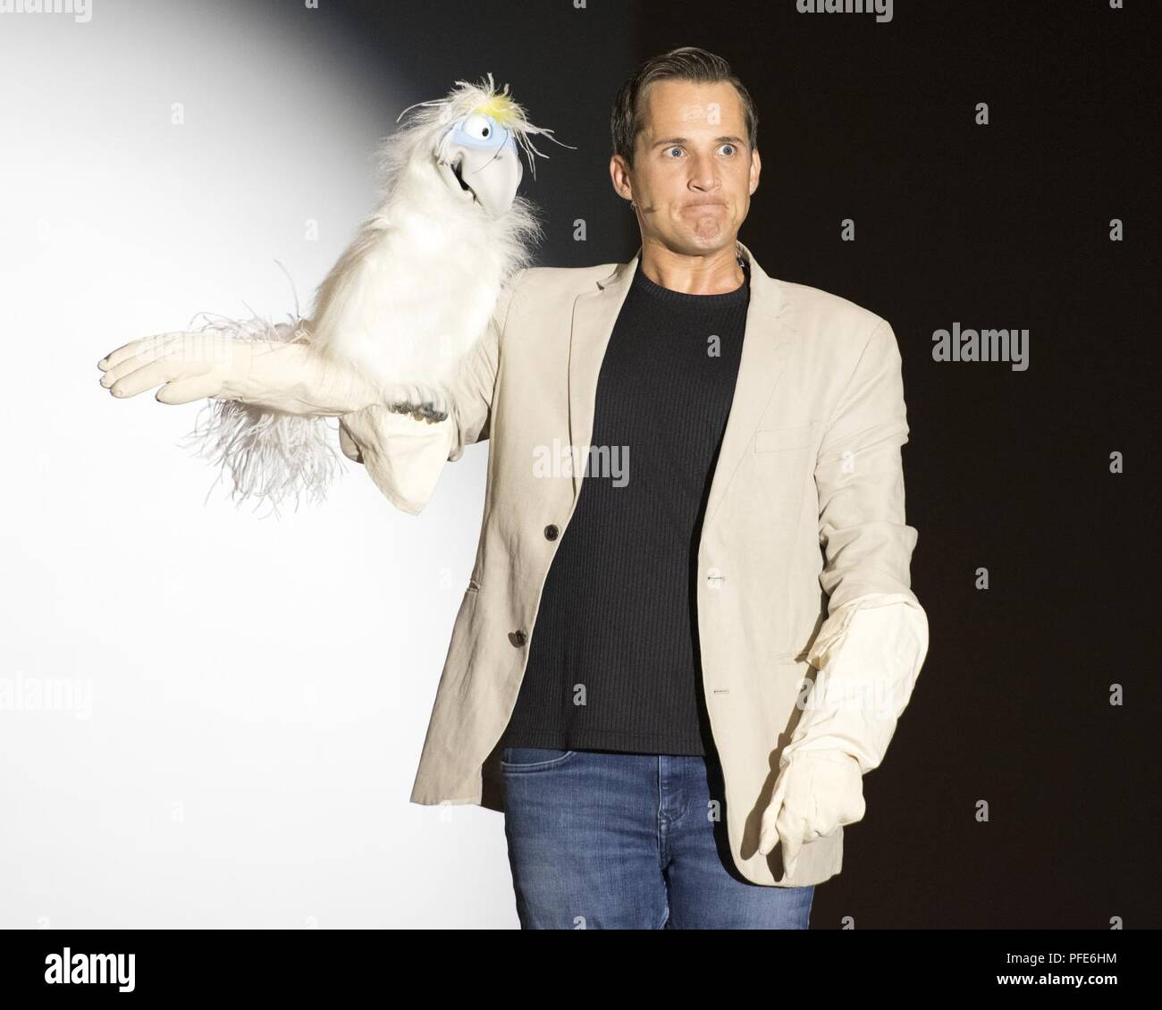 Comedian and ventriloquist entertainer, Ryan, performs on stage with ...