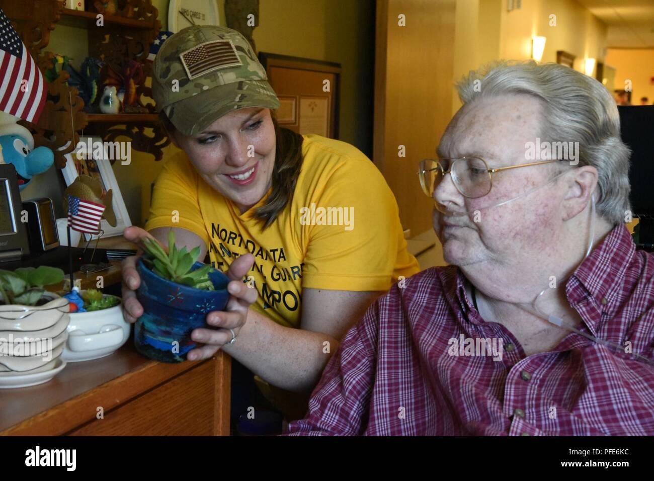 U.S. Air Force Tech. Sgt. Shelly Fink, of the 119th Wing, presents a ...