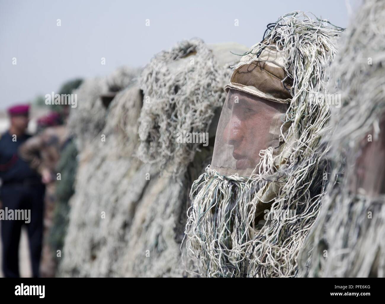 Iraqi Counter Terrorism snipers dressed in gillie suits stand ready to ...